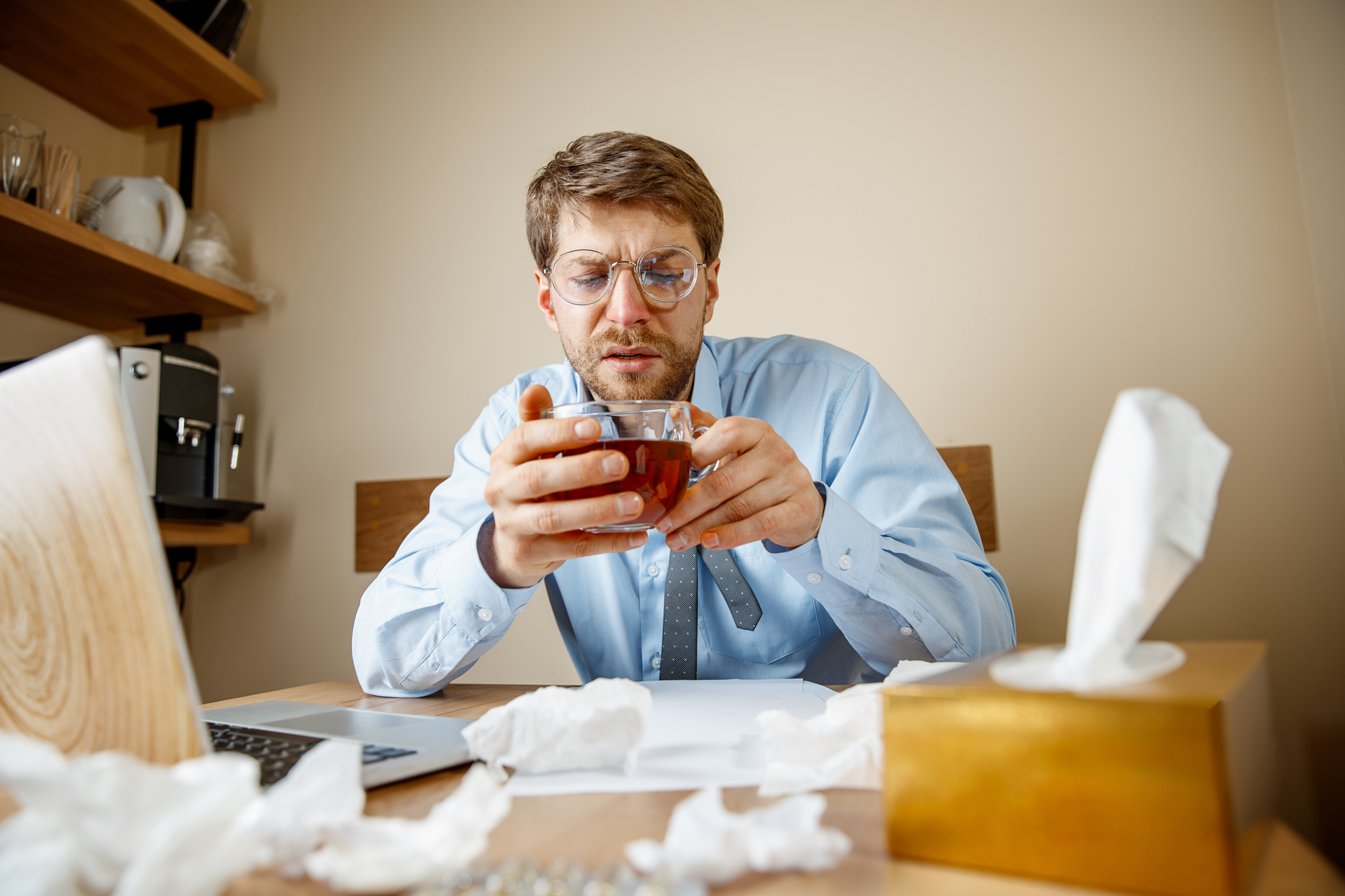 Sick man while working in office, businessman caught cold, seasonal flu ...